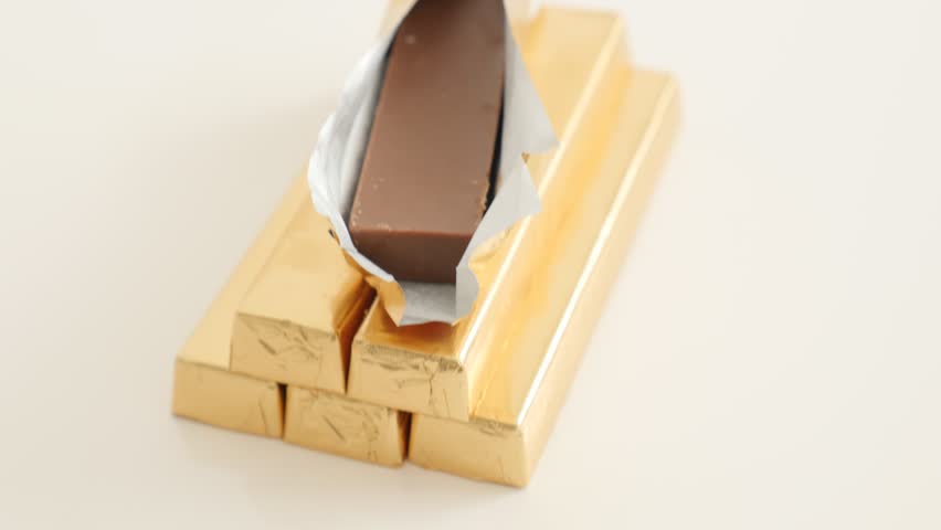 Luxurious Golden Foil Wrapped Chocolate Bars On White Surface 4K 2160p ...