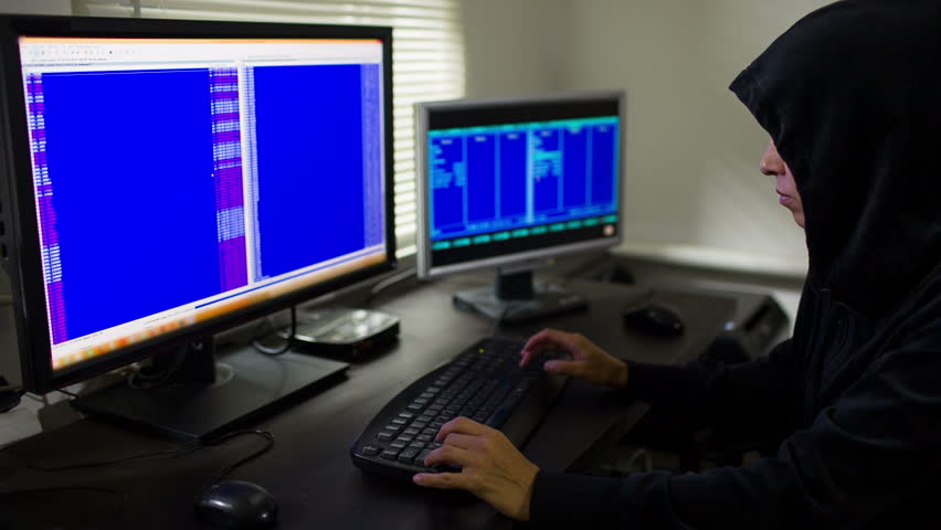 Stock video of hacker in hood cracking code using | 10602488 | Shutterstock