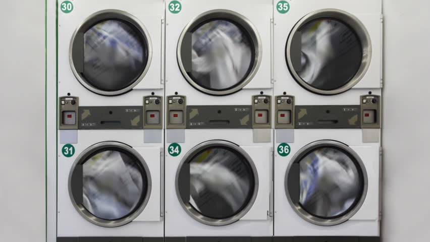 Stock Video Clip of six large washing machines in public laundry ...