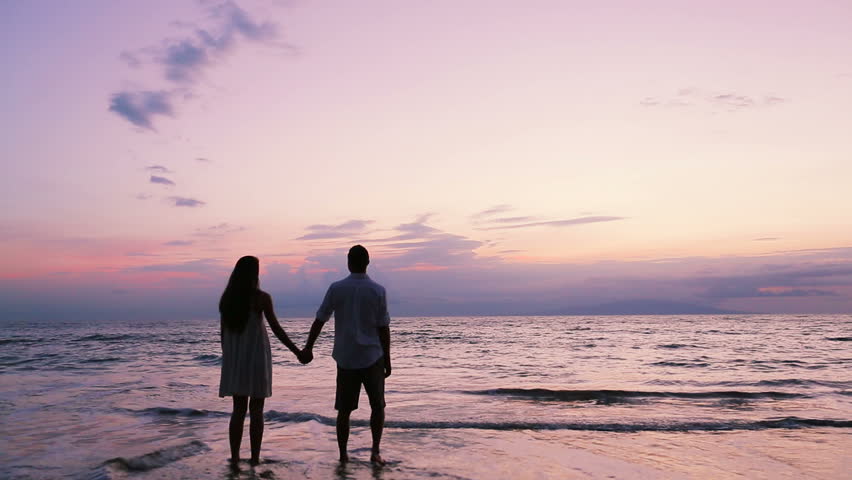 Young Couple Standing On Beach In Sunset Stock Footage Video 8175730 ...