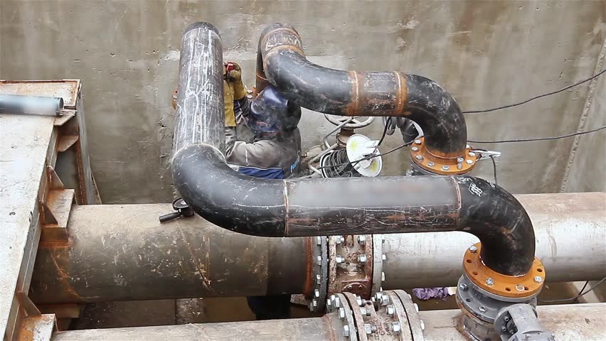 Manhole, Metalworker Is Preparing Pipeline Node For Welding. Metal ...