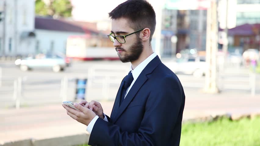 Business Man In Tourist City Checking Cell Phone For New Messages Stock ...