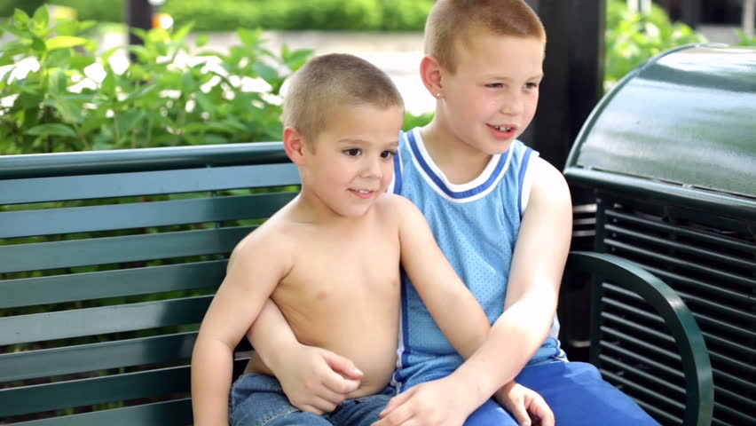 Stock video of two cute boys sitting on park | 1190338 | Shutterstock