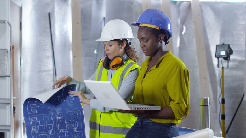 Construction Workers Look Over Plans And Discuss Stock Footage Video ...