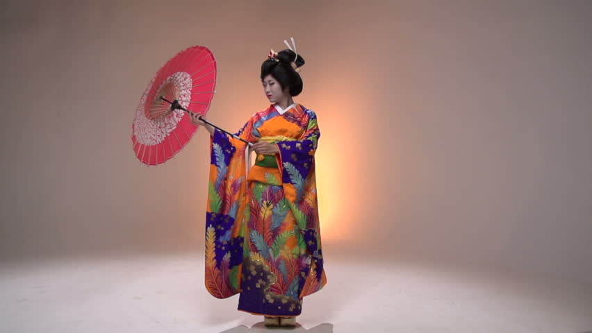 Stock Video Clip of Japanese geisha performer posing in Studio with ...