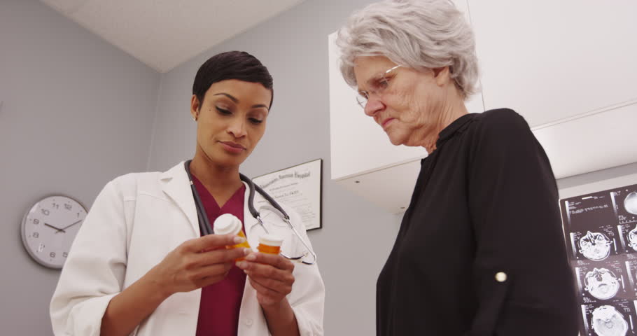 Senior Doctor Texting In The Office And Ignoring Patient Stock Footage ...