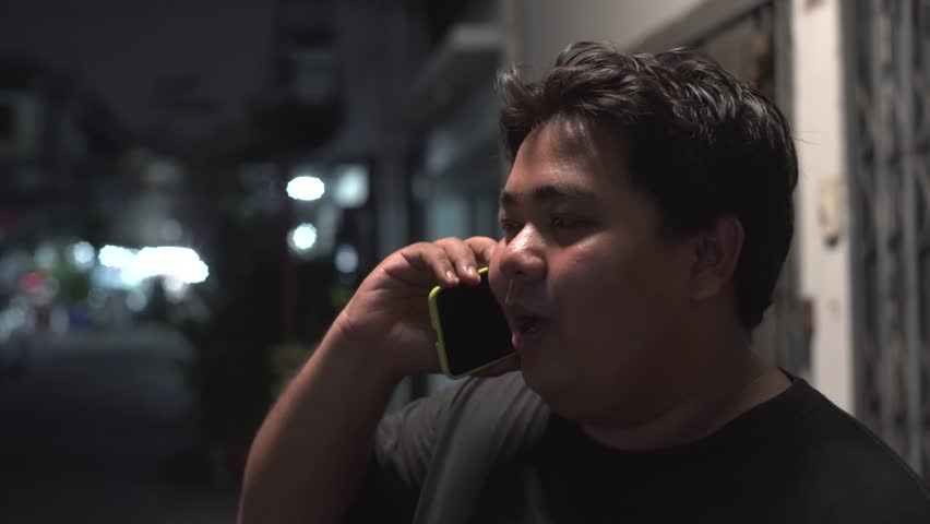 Stock video of happy fat young man talking on | 13549028 | Shutterstock