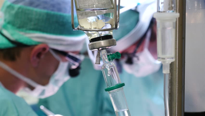 Adjusting Medical IV Drop Rate (HD). Nurse Controlling Intravenous Drip ...