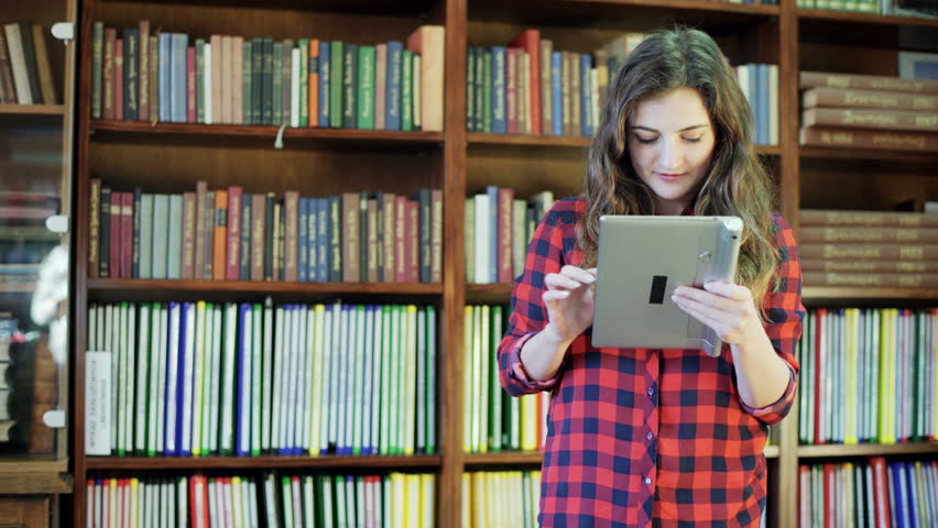 Charming Woman Reading In A Library Stock Footage Video 1335595 ...