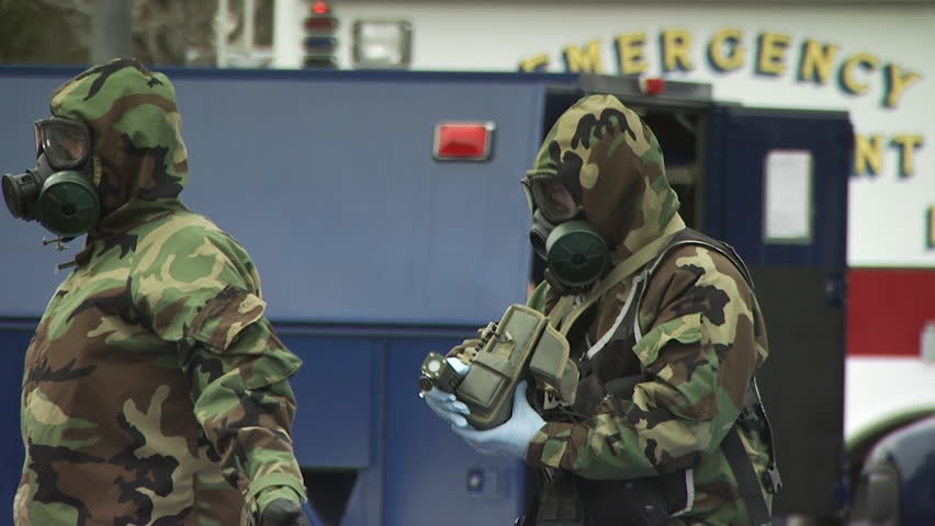 HAZMAT Team Members Wearing Protective Suits To Protect Them From ...