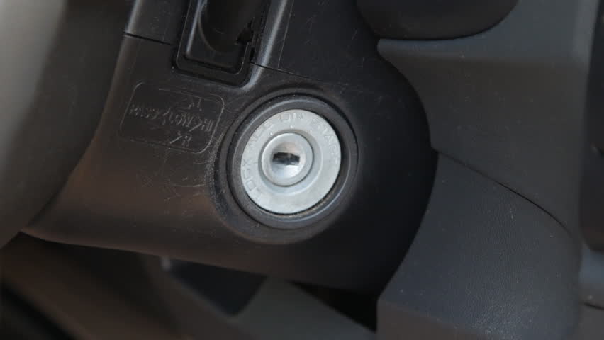 Stock Video Clip of Hand putting car key to the keyhole | Shutterstock