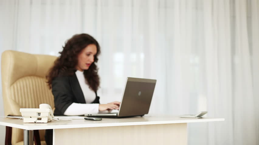 A Young Business Woman Working Hard At Her Desk,she Is Overwhelmed By ...