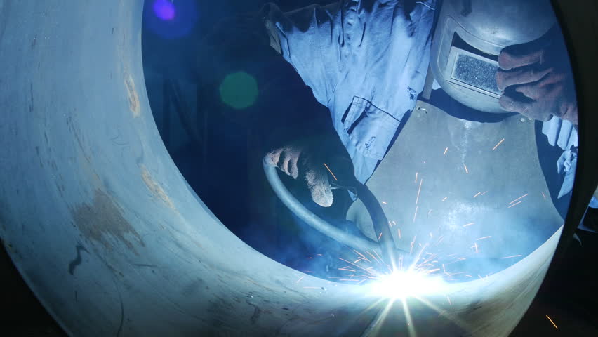Welder Inside Pipe, Welding The Seam To Create One Continuous Section ...