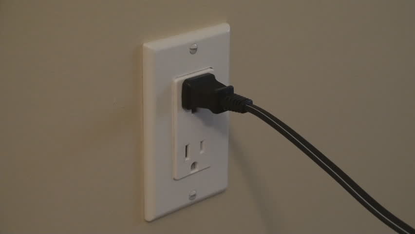 Unplugging Cord From Outlet To Save Electrical Energy Stock Footage ...