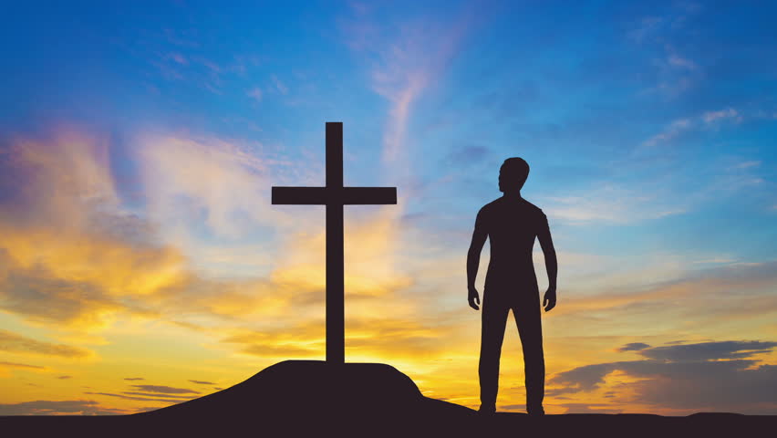 Silhouette Of Man Praying Under The Cross At Sunset/sunsrise Stock ...
