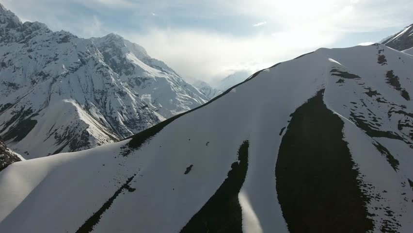Flying Over Mountains Covered with Stock Footage Video (100% Royalty ...