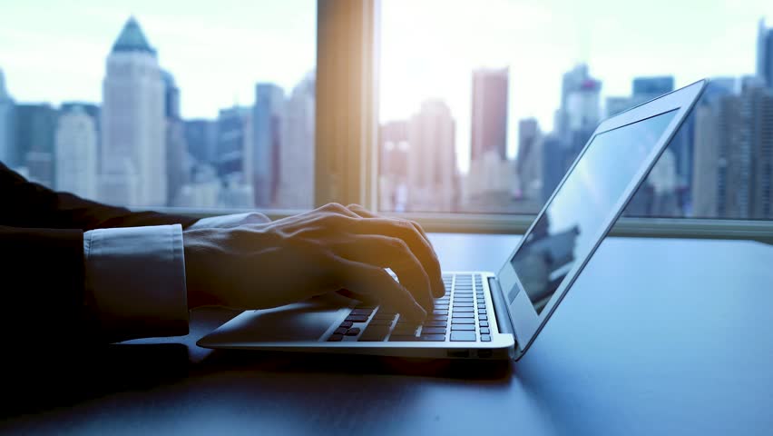 Working On Laptop Computer In Modern Office Desk Analyzing Financial ...