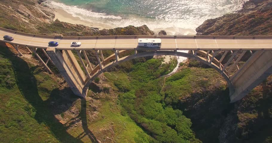 Aerial Shot Of Cars Passing Bixby Creek Bridge On PCH Highway 1 ...