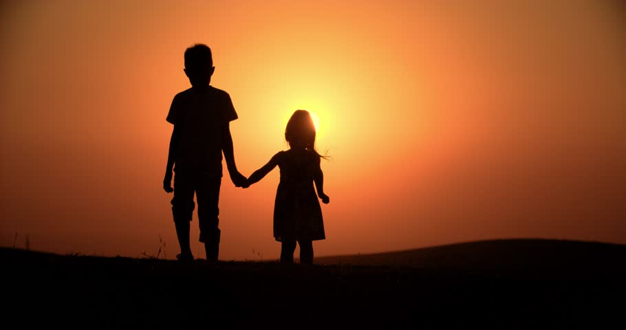 Silhouette Of Two Children, A Brother And Sister Walking Holding Hands ...
