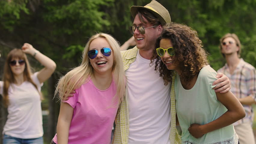 Carefree Male Female Teenagers Bright Clothes Enjoying Weekend Break ...