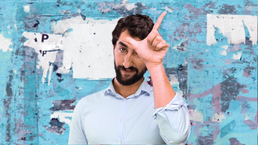 Stock video of young funny man loser sign at | 20965348 | Shutterstock
