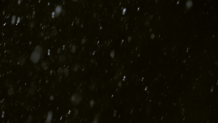 Slow Motion Footage Of Snow Fall, Isolated On A Black Background ...