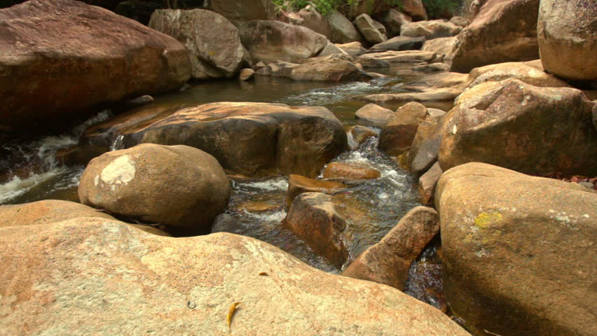 Large Round Brown Boulders On Small Mountain River With Waterfall ...