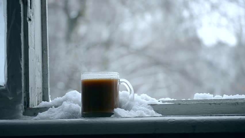 Cup Of Coffee Covered Of Wool On A Wooden Table While Snowing. Bistro ...
