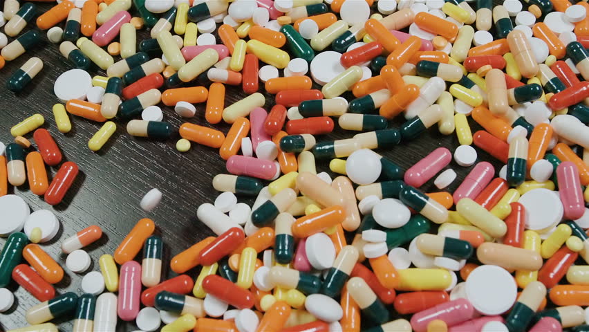 Pills Falling On White Background Top View In Slow Motion Stock Footage ...