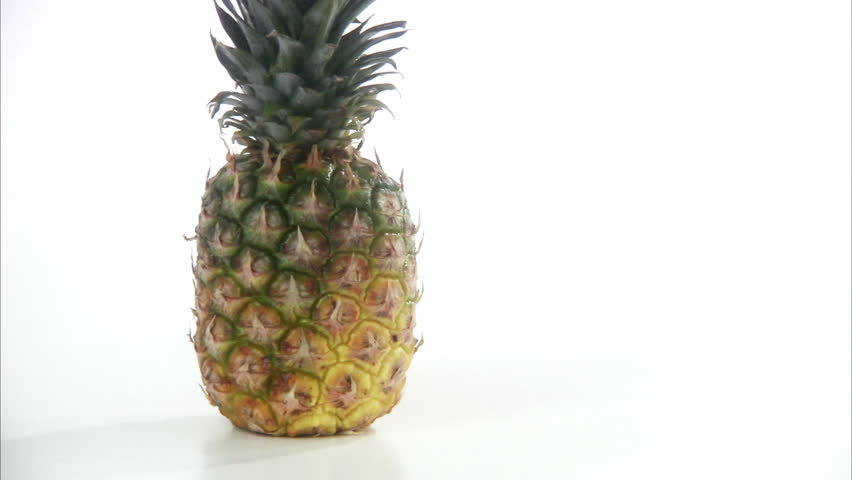 Pineapple Spinning Slowly On White Background Stock Footage Video ...