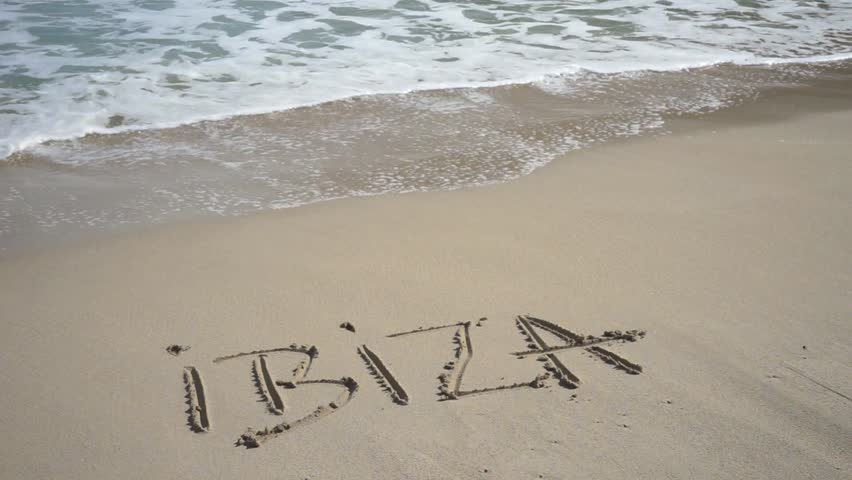 The Word Majorca Written On A Sandy Beach Shore Washed Away From Waves ...