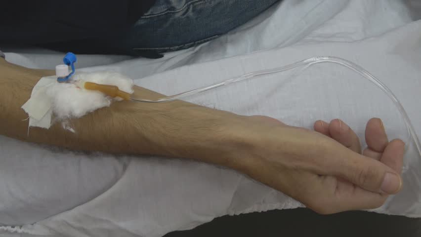 Doctor Putting Compression Glove On Injured Arm And Hand. Man In ...