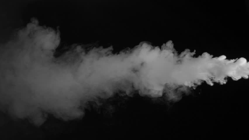 Smoke In Super Slow Motion Appearing Against A Black Background Stock ...