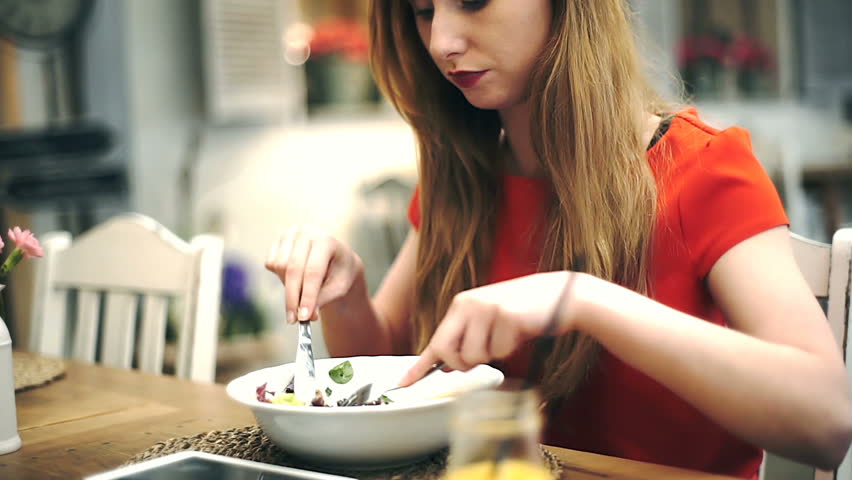 Pretty Girl Eating Delicious Lunch And Drinking Orange Juice, Steadycam ...