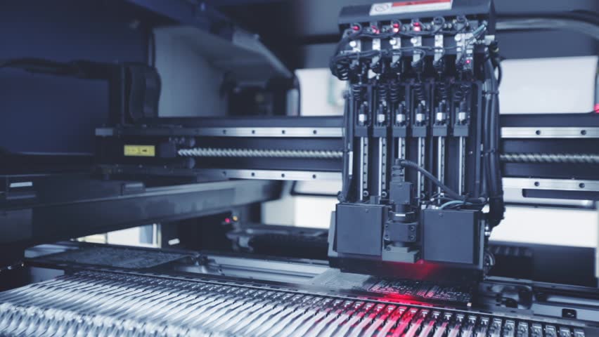 Automated Electronic Circuit Board Production Close Up. Machine ...