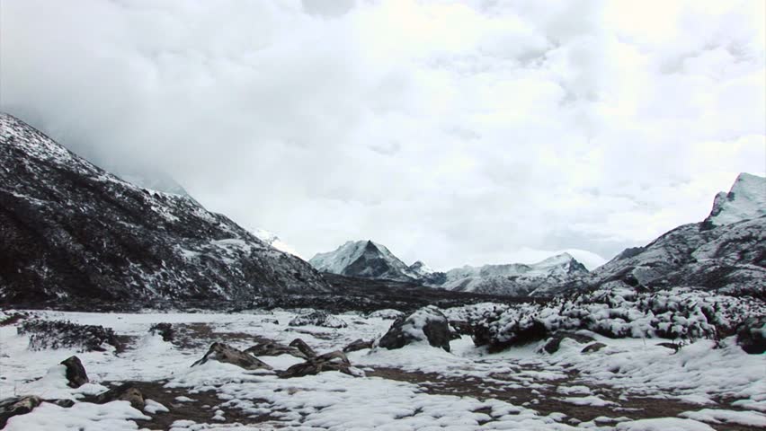 Climbers Walking In The Distance With Mt. Everest Pinnacles And Summit ...