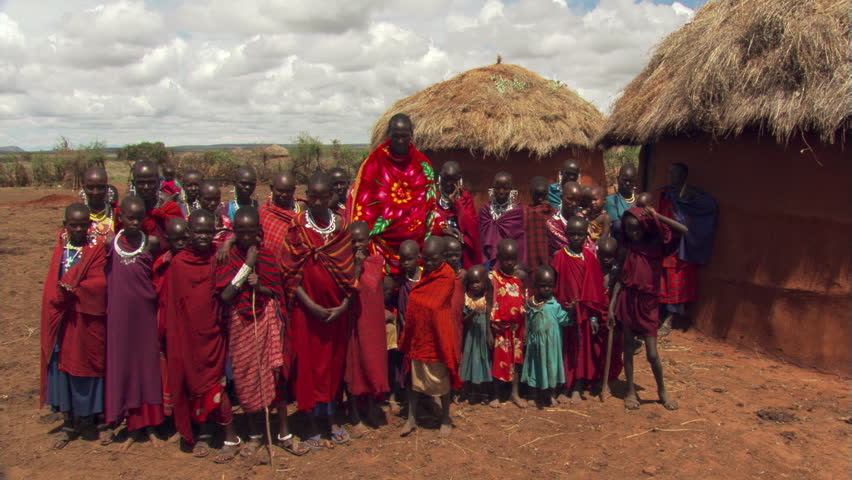 African Village, Old Houses And People In Traditional African Clothes ...