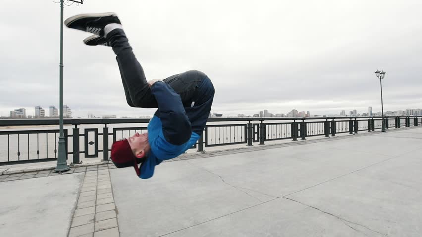 Slow-motion Acrobatics - Teenager Performing Somersault Outdoor Stock ...