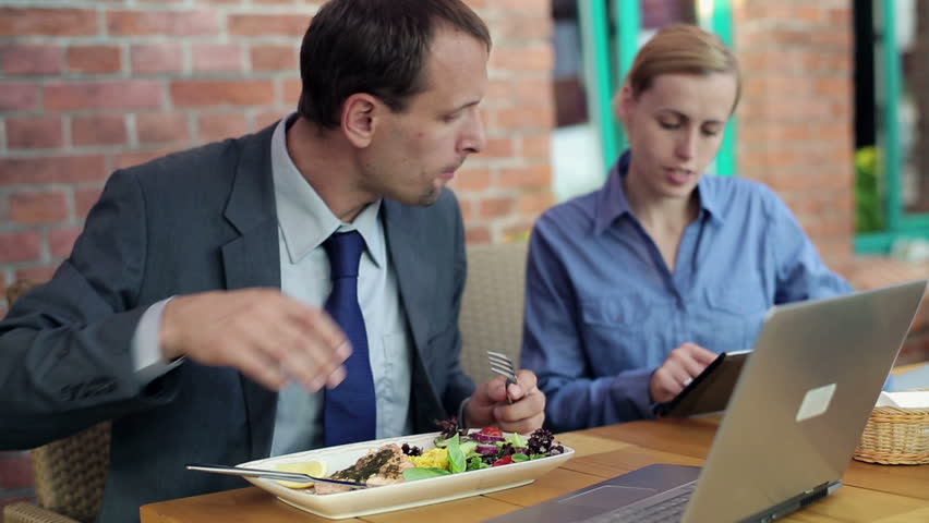 Stock Video Clip of Business people working with laptop and tablet ...