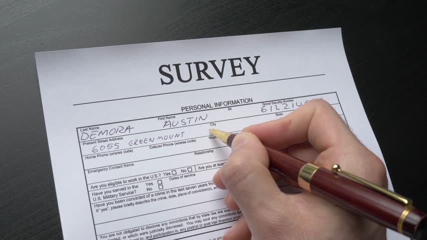 Close-up Of A Person's Hand Filling Customer Survey Form Stock Footage ...