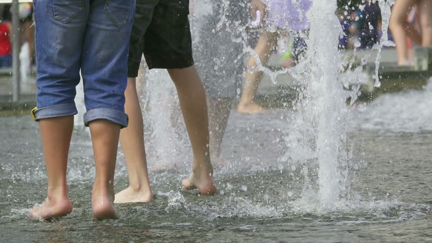 Many People Walking On A Rainy Day With Wet Shoes In The City With Rain ...