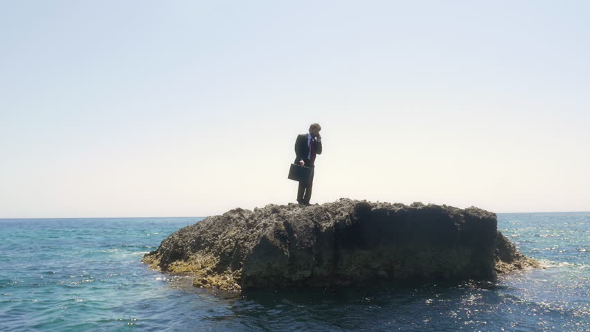 Stock Video Clip of Man in suit with a briefcase stranded | Shutterstock