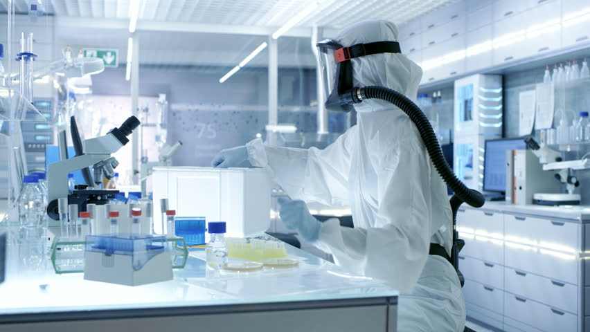 Medical Virology Research Scientist Works In A Hazmat Suit With Mask ...