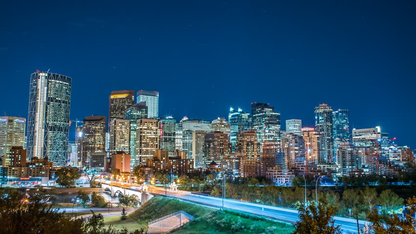 Lights with saddledome and skyline at night in Calgary, Alberta, Canada ...