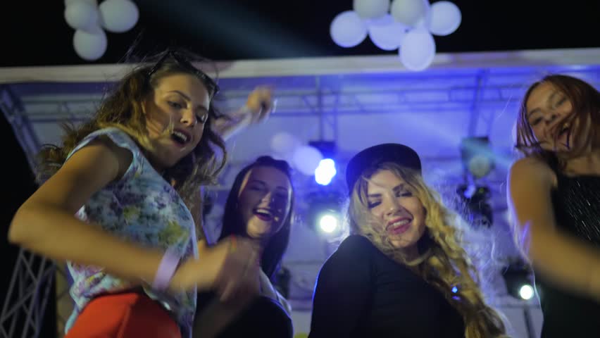 Back Of Young Woman Dancing In Crowd In Night Club During Big Party ...
