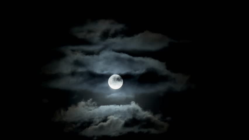 Dark Night Sky With A Full Moon Shining Bright As Clouds Move Across The Face Of The Moon. Stock ...