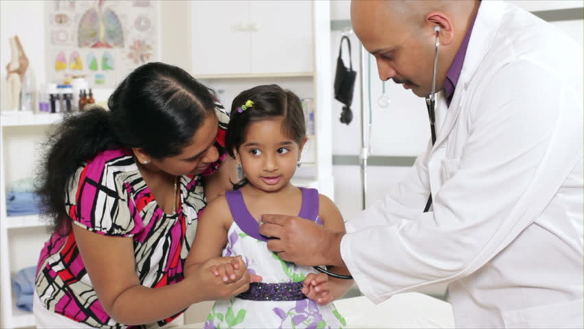 An Indian Pediatrician Or Family Doctor Listens To The Heart Of A ...