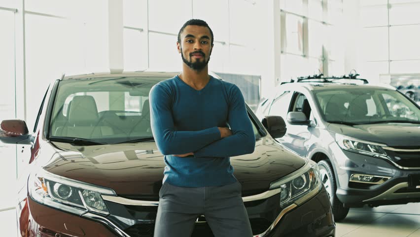 Video de stock de attractive cheerful young african man smiling ...