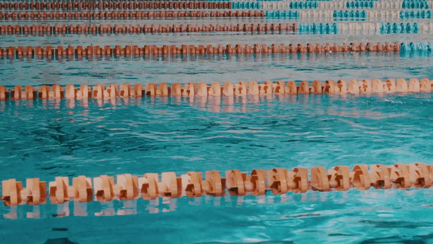 Swimmer In Action In Waterpool With Blue Water At Sunny Day. Slow ...