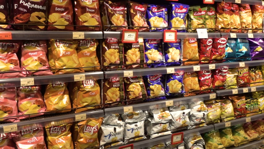 Fast Food Snacks For Sale On Supermarket Shelf. Various Brand Of Potato ...